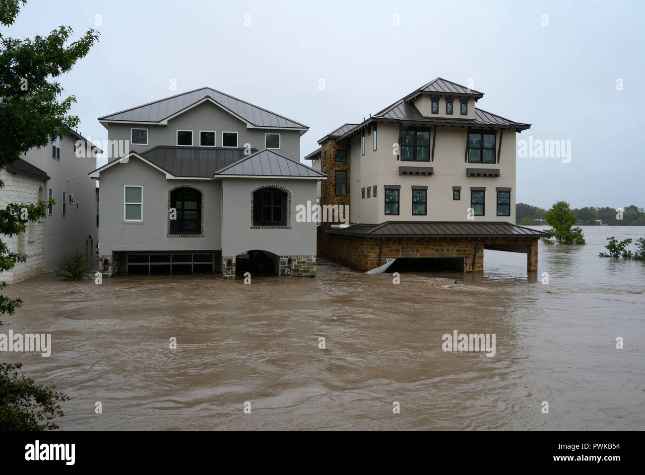 Heavy rains in the Texas Hill Country cause flooding on Lake LBJ, with mud- and debris-filled ...