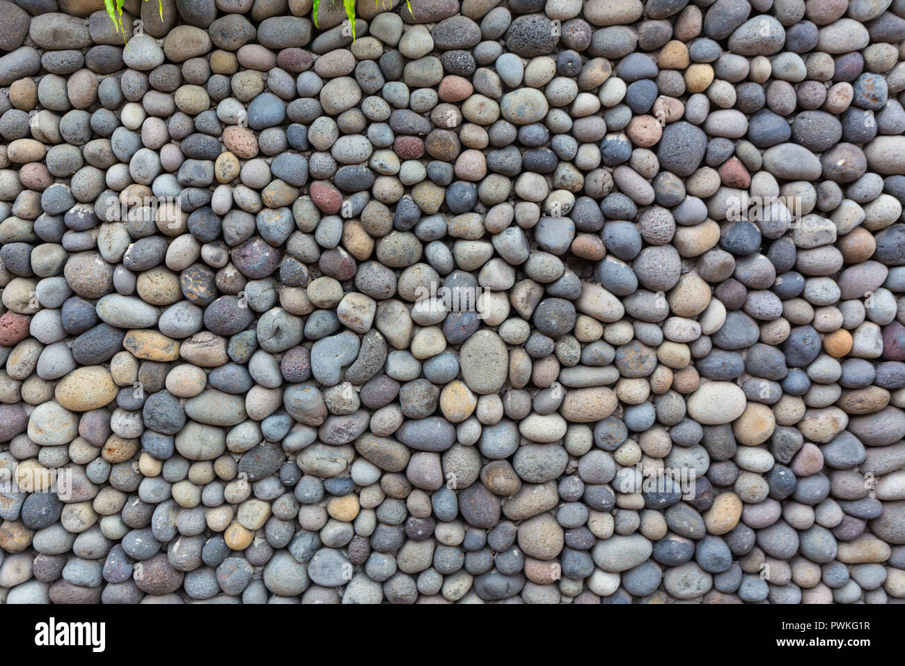 Background texture, wall consisting of small river stones Stock Photo ...