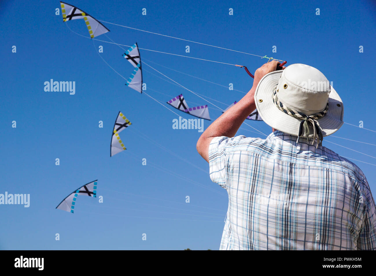 Man start to fly a kite in the sky Stock Photo - Alamy