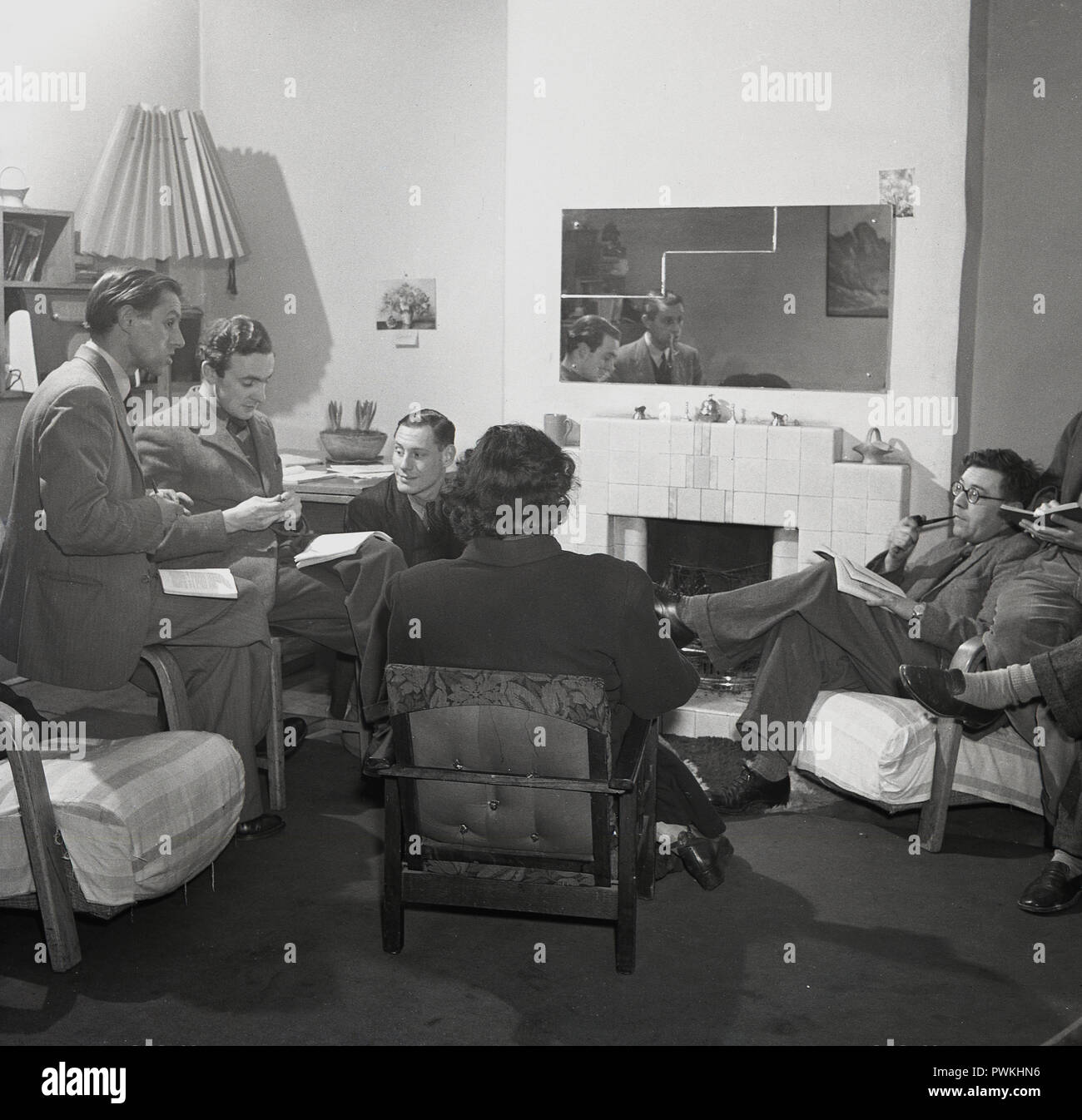 1950s, historical, group of teachers seating on low-level armchairs in ...