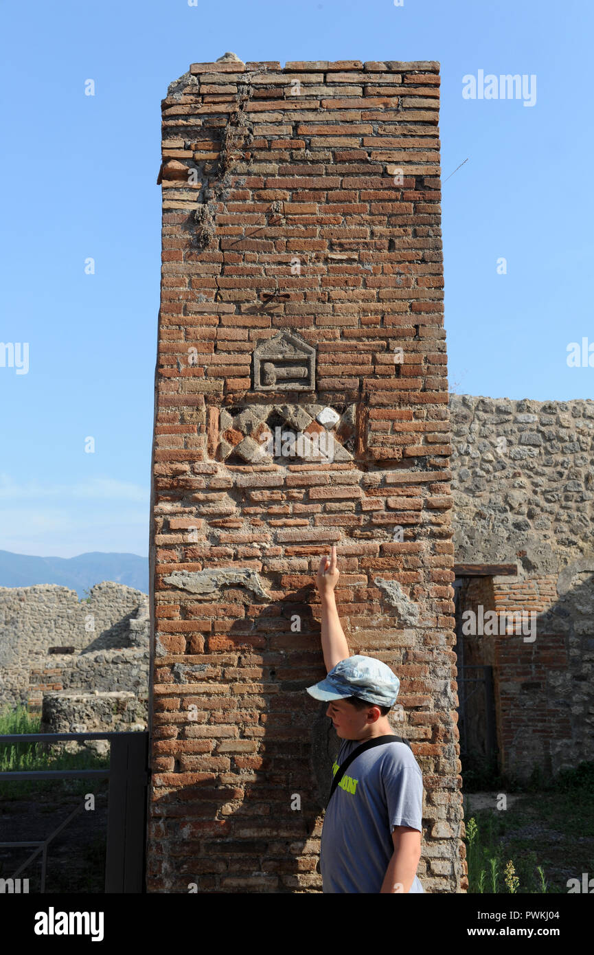 Phallic erotic art carved onto the walls of house in Pompei, Italy ...