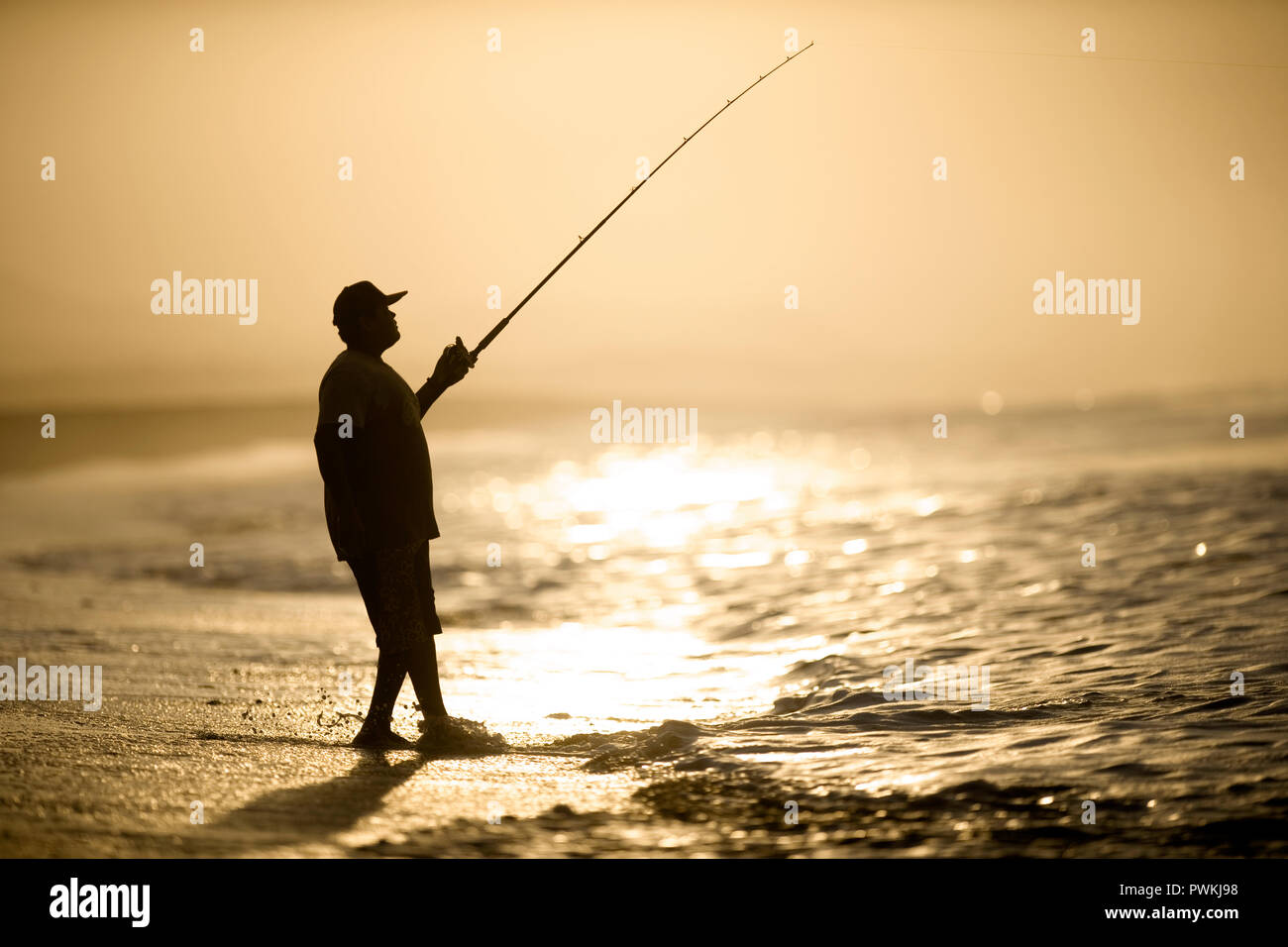 Side profile of a man fishing hi-res stock photography and images - Alamy