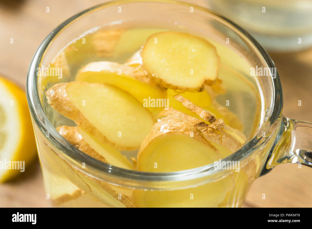 Homemade Fresh Ginger Tea with Lemon in a Mug Stock Photo - Alamy
