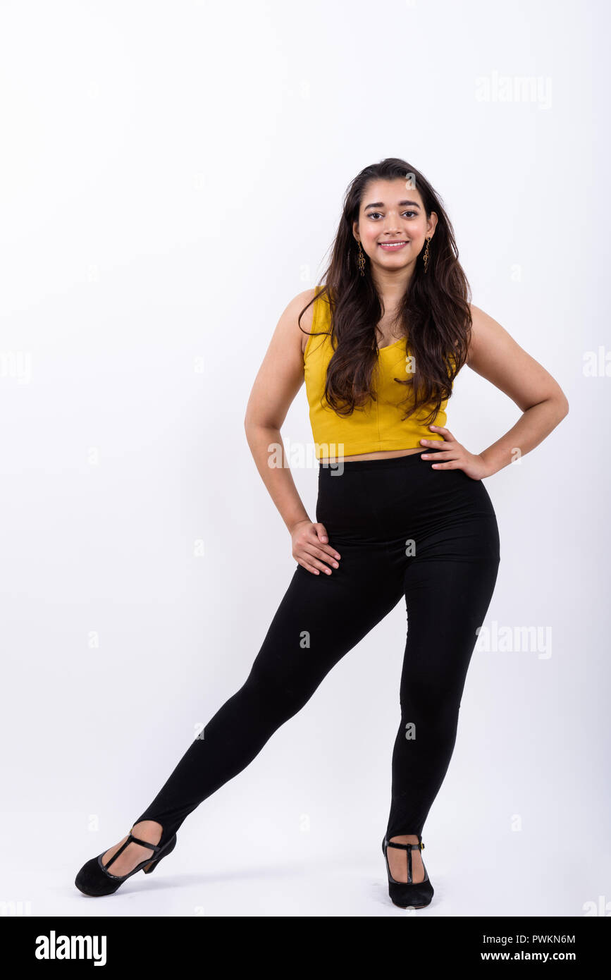 Full body shot of young happy Indian woman smiling while posing Stock ...