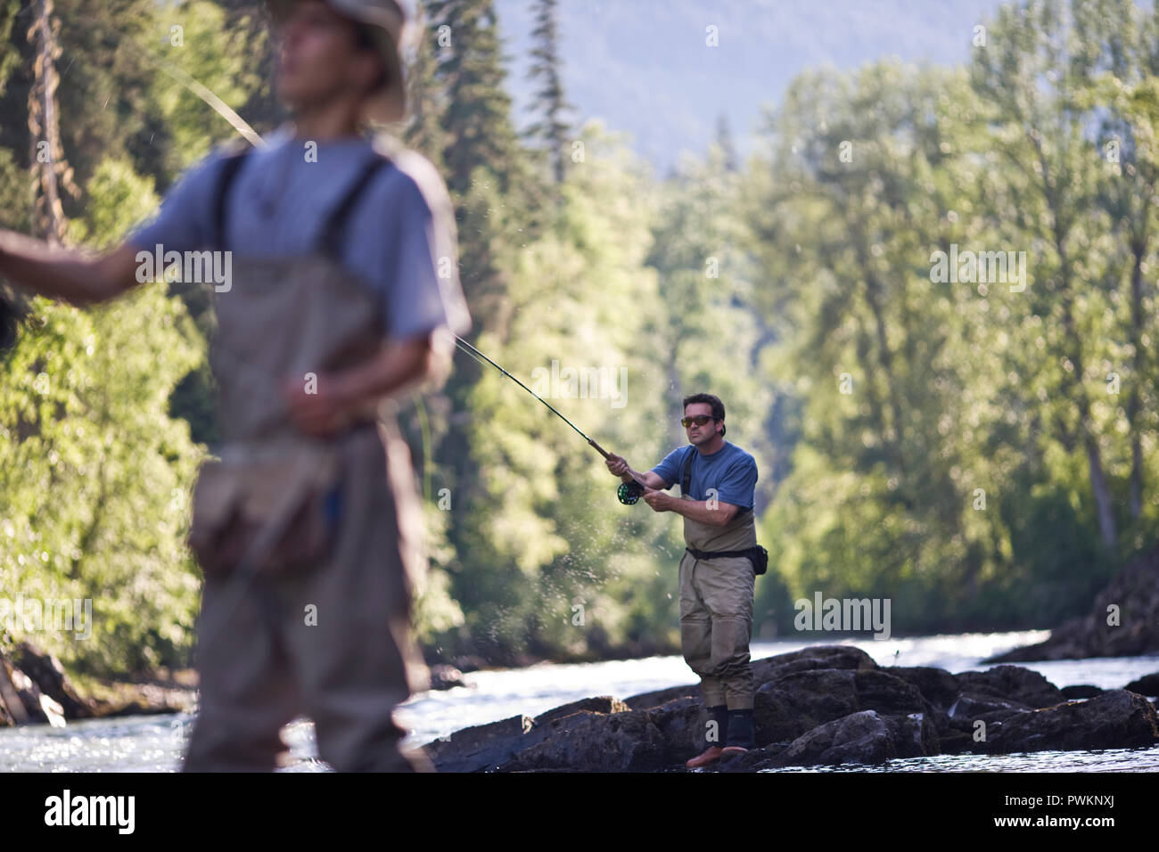 3 men in river hi-res stock photography and images - Alamy