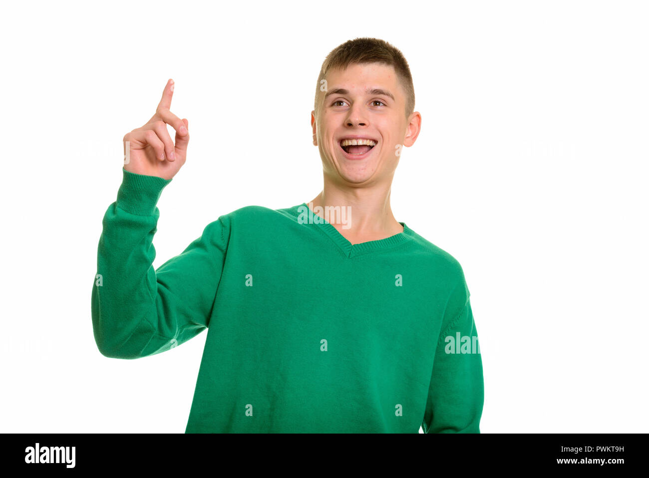 Thoughtful young happy Caucasian man smiling and pointing finger Stock ...