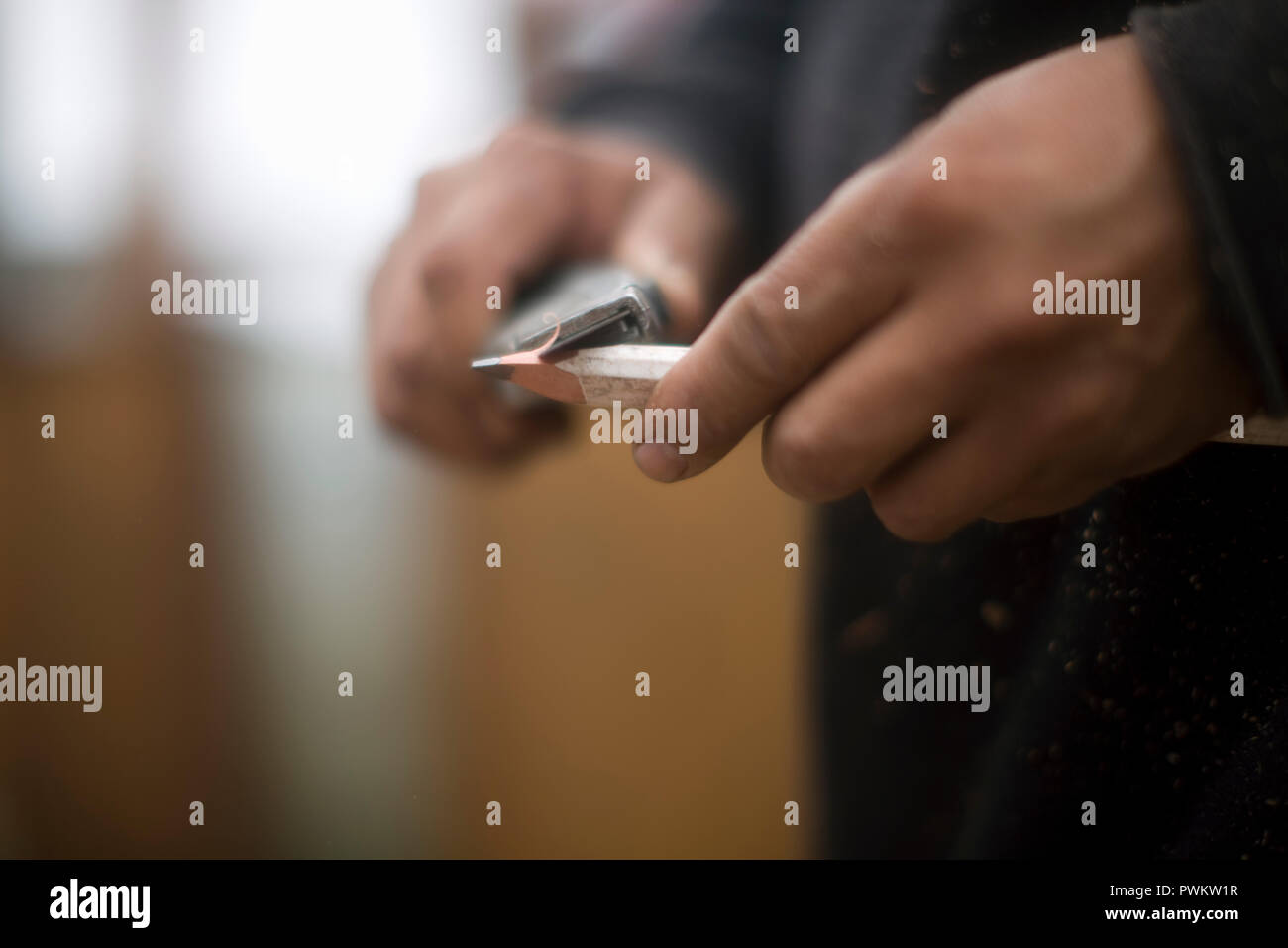 Man sharpening pencil hi-res stock photography and images - Alamy