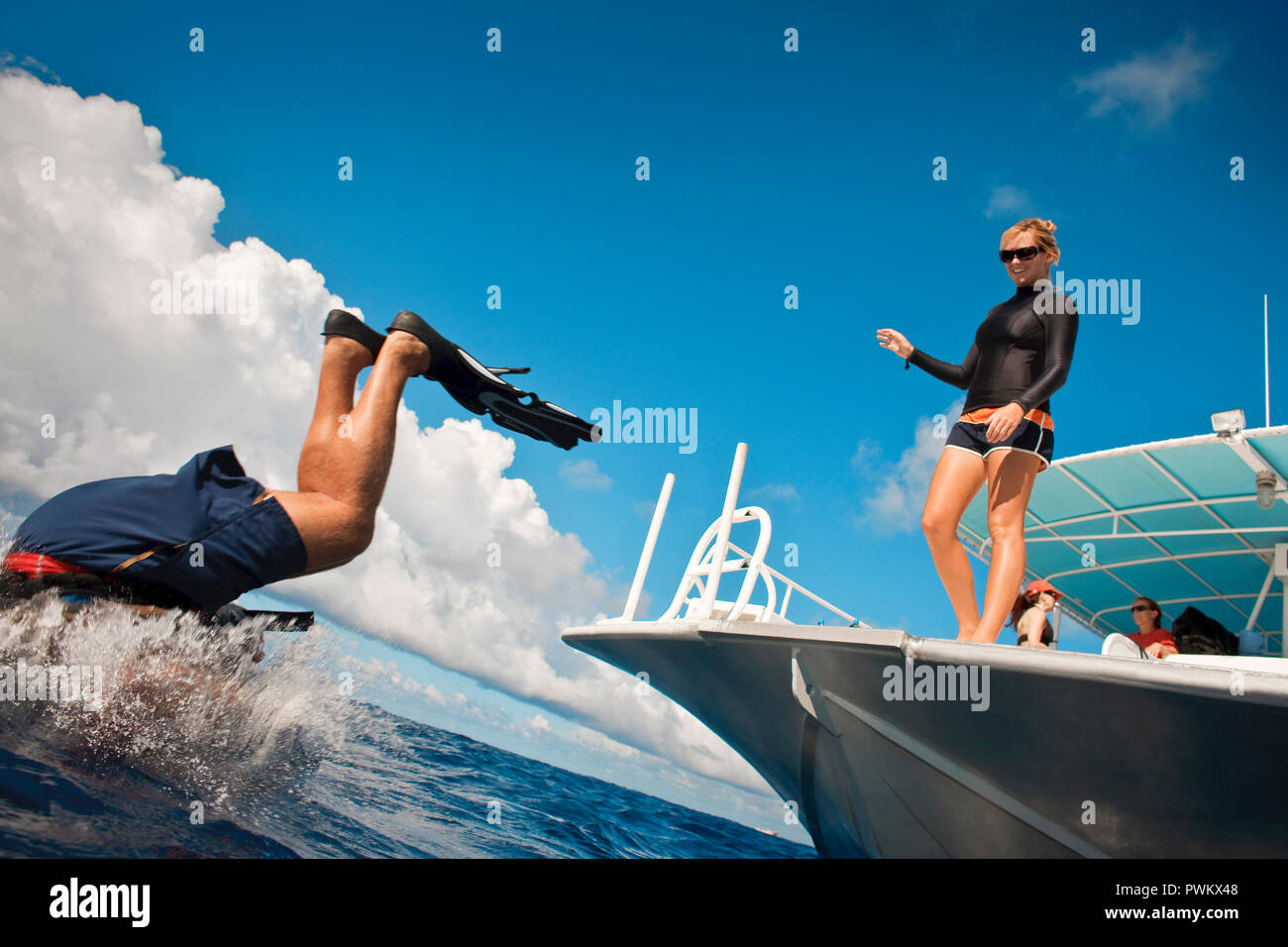 Male diving from boat hi-res stock photography and images - Alamy