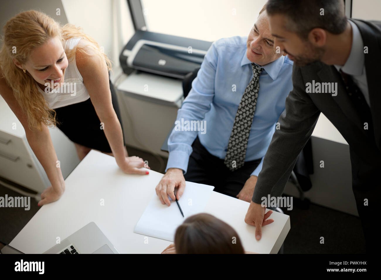Co-workers brainstorming in boardroom meeting Stock Photo - Alamy
