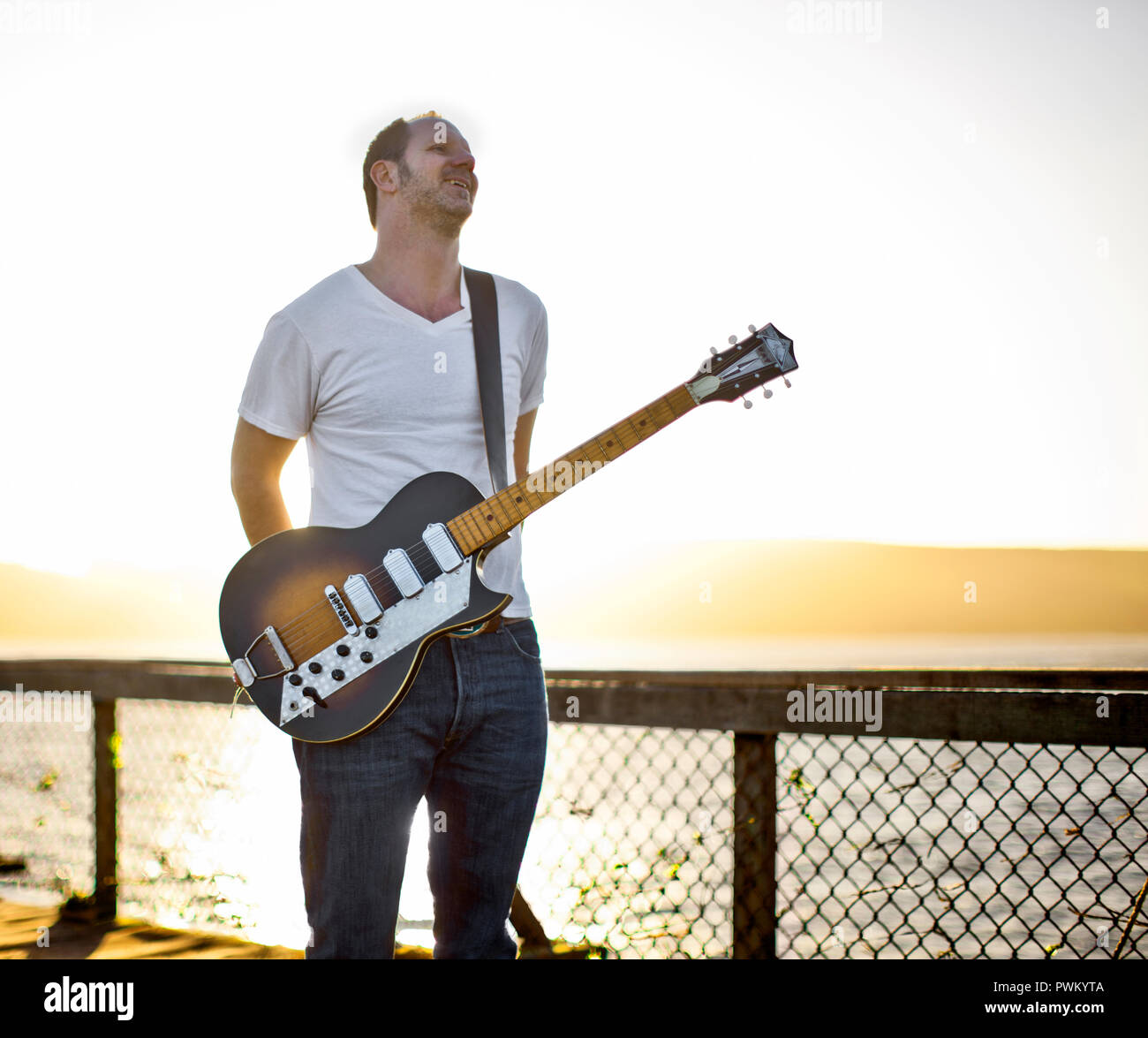 Guitars instruments smiling laughing hi-res stock photography and ...