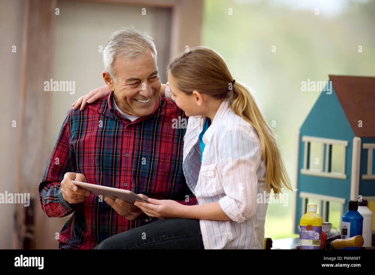 Person looking at ipad and laughing hi-res stock photography and images ...