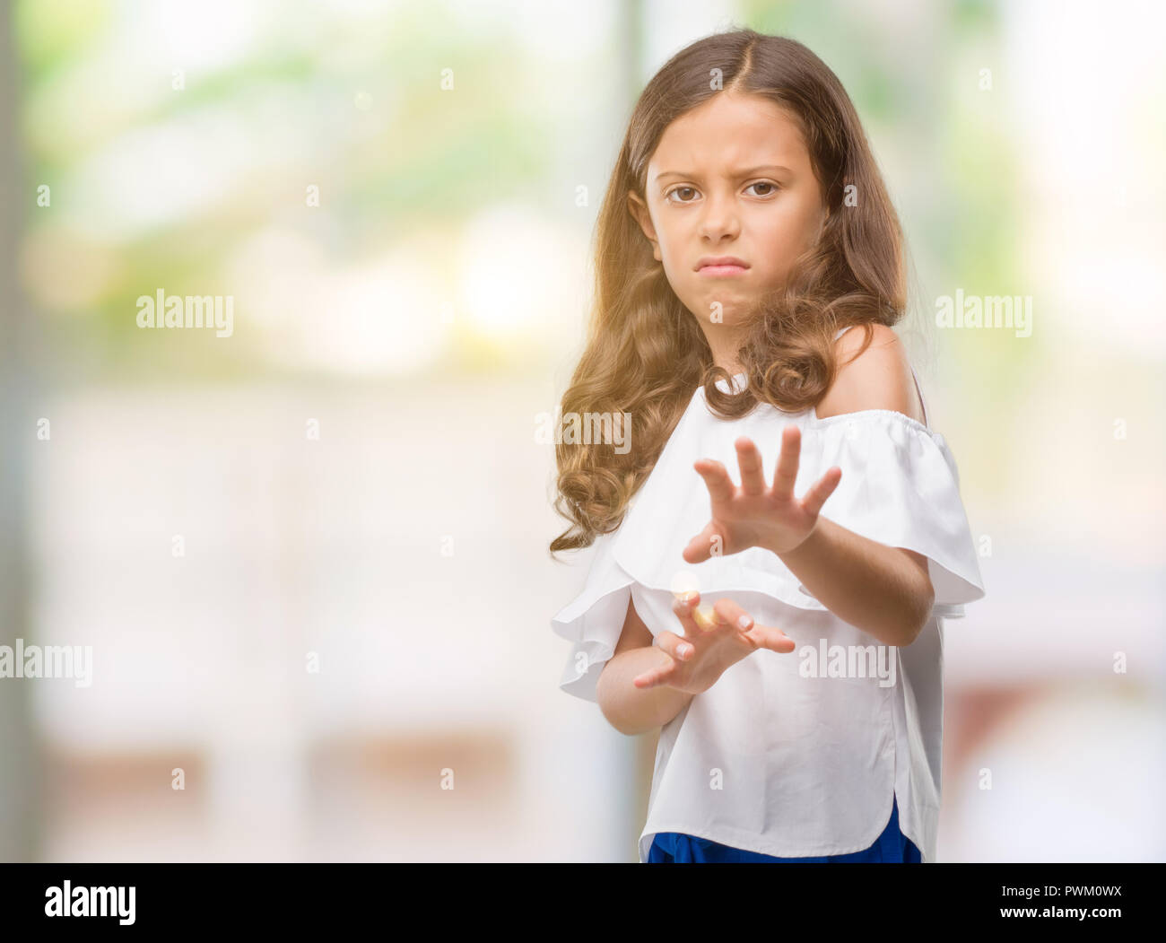 Brunette hispanic girl disgusted expression, displeased and fearful ...
