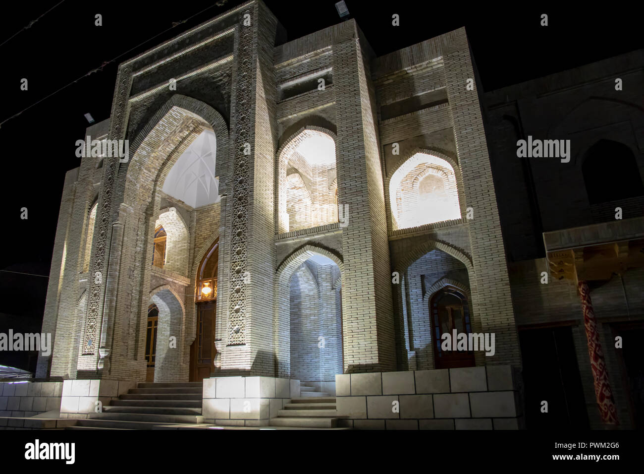 Islamic historic architecture illuminated at night in Bukhara ...