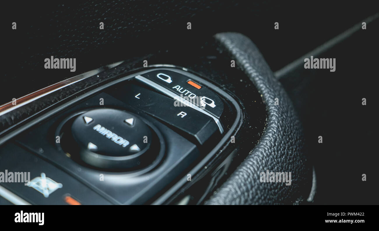 black exterior mirror control knob in a modern car Stock Photo - Alamy