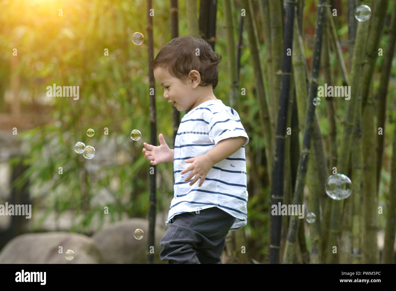 malay boy child blowing soap bubbles outdoors Stock Photo - Alamy malay boy child blowing soap bubbles outdoors Stock Photo - Alamy