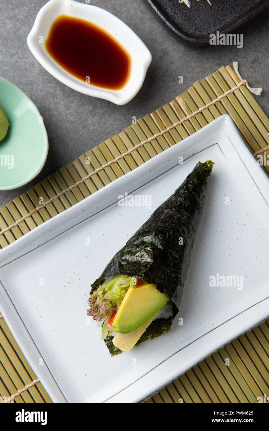 Sushi temaki with shrimp and avocado Stock Photo - Alamy