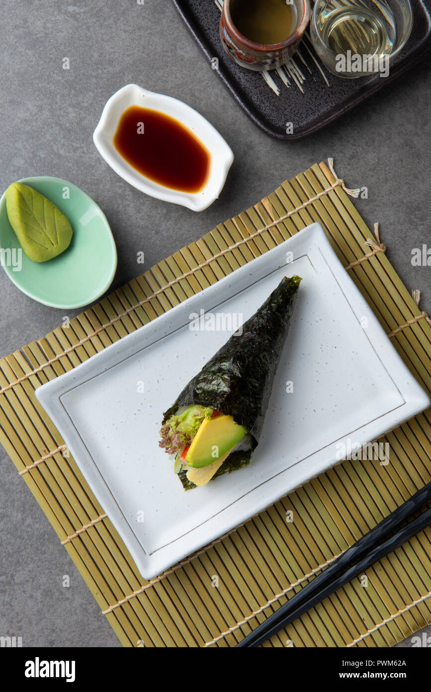 Sushi temaki with shrimp and avocado Stock Photo - Alamy