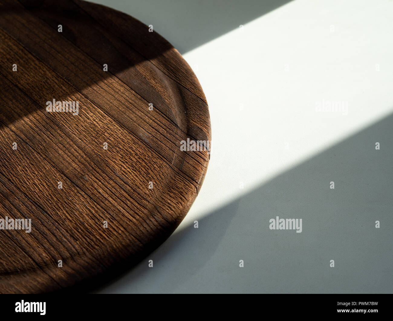 lines of sunlight and shadows on the surface; wooden texture and white ...
