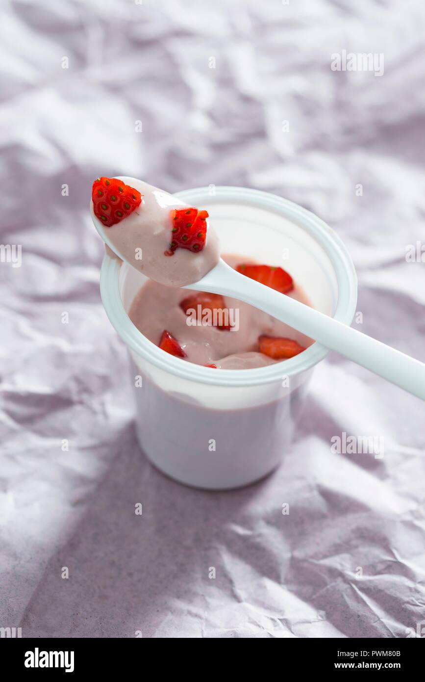 Soya yoghurt in a plastic pot with fresh strawberries (vegan Stock ...