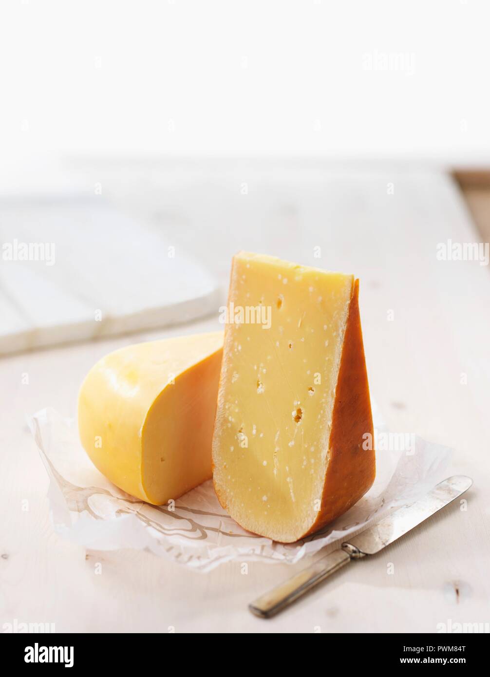 Two slices of Gouda cheese Stock Photo - Alamy