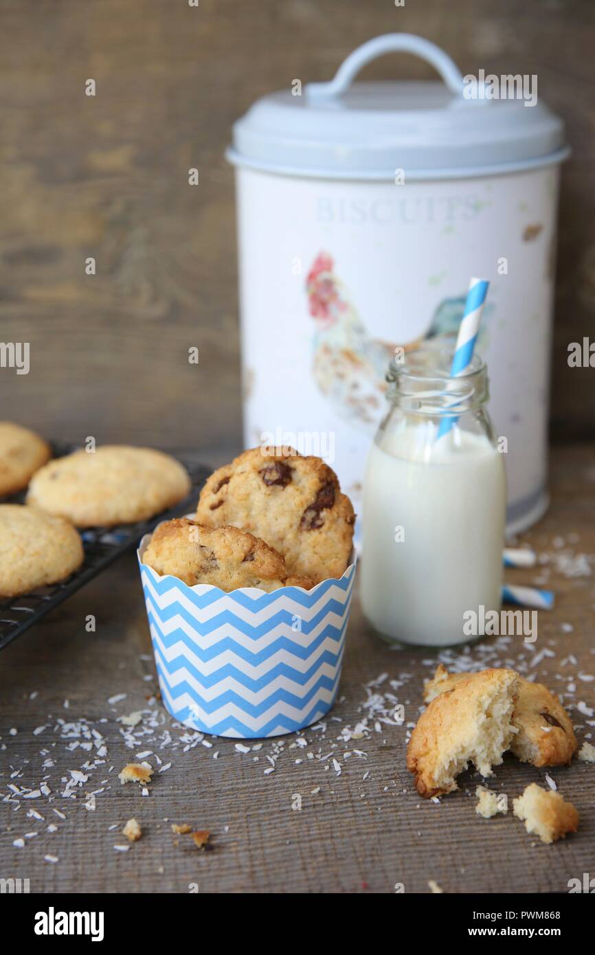 Coconut cookies with chocolate chip and a bottle of milk Stock Photo ...