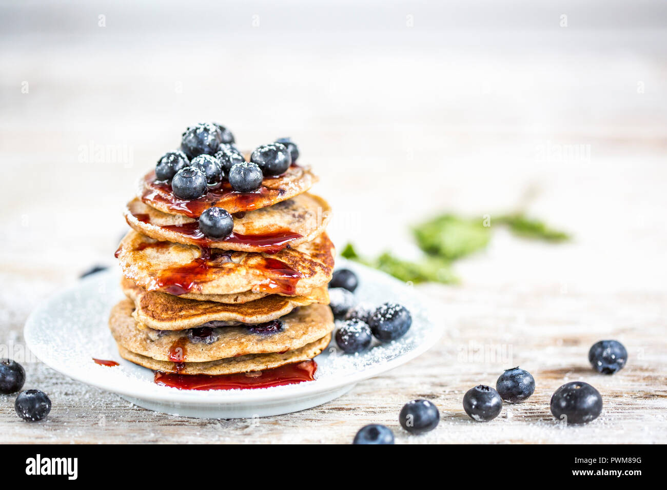 Blueberry pancakes with blueberries and maple syrup Stock Photo - Alamy