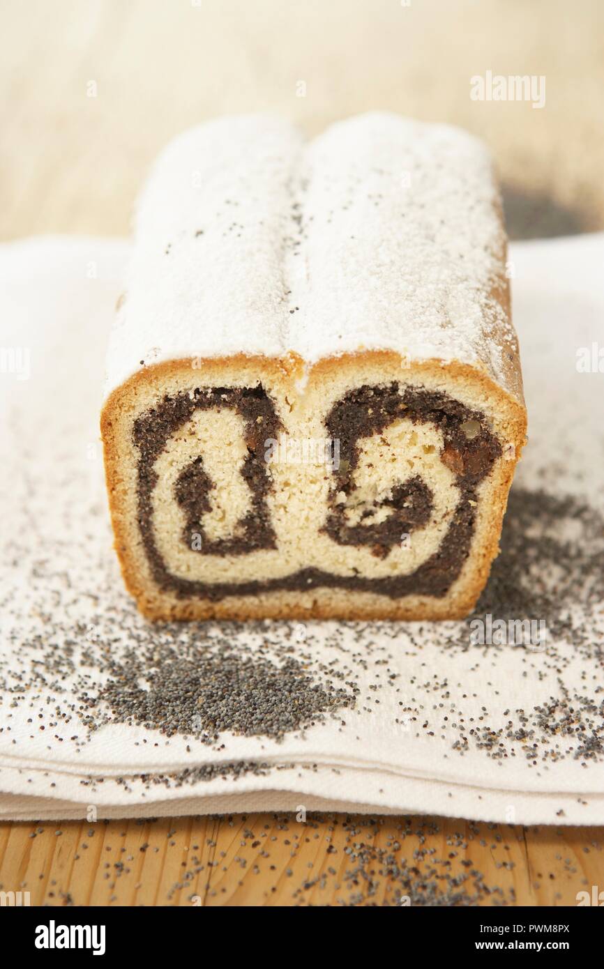 Poppyseed stollen with icing sugar Stock Photo - Alamy