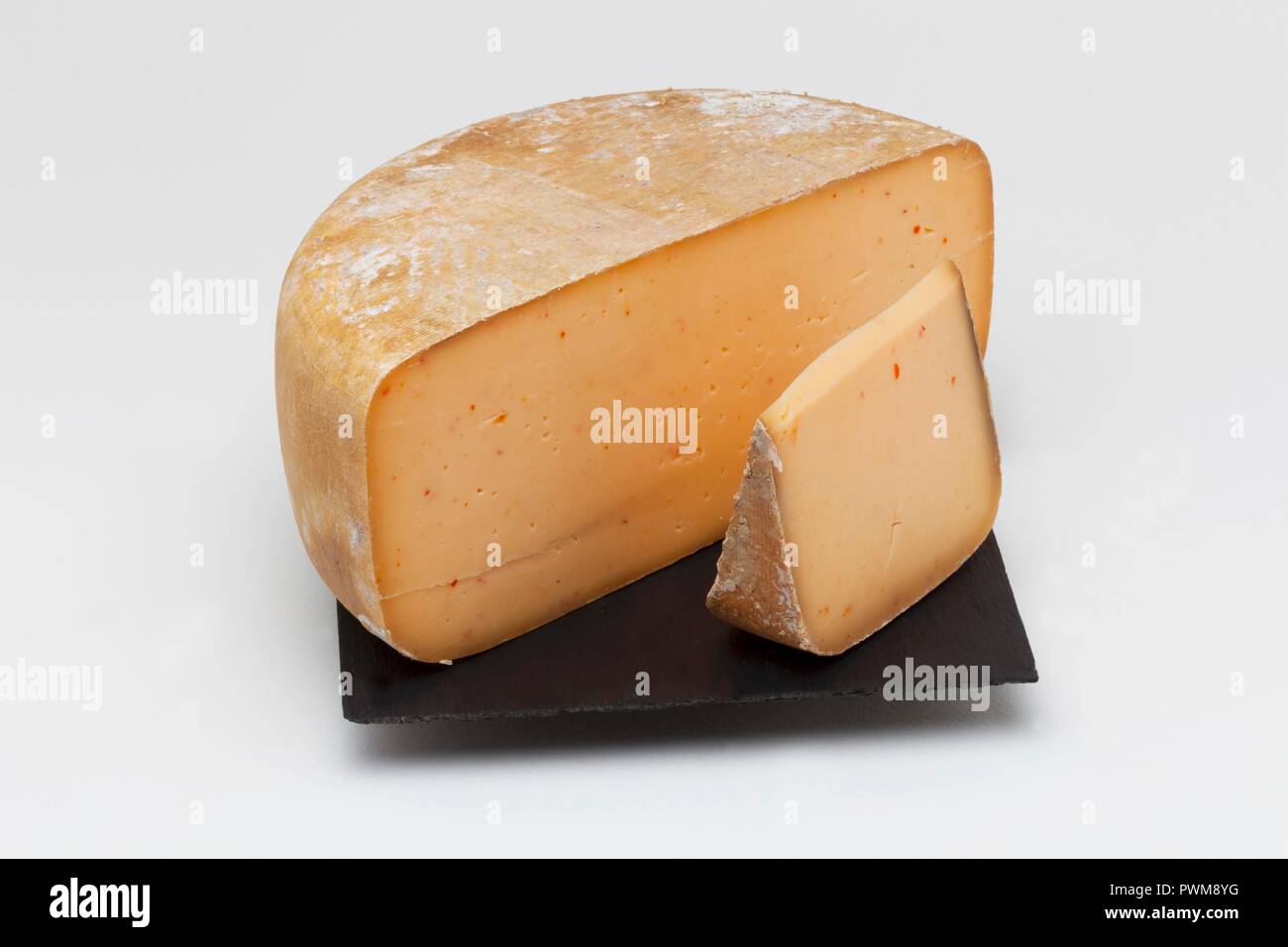 Basque cheese with piment d'espellette Stock Photo - Alamy