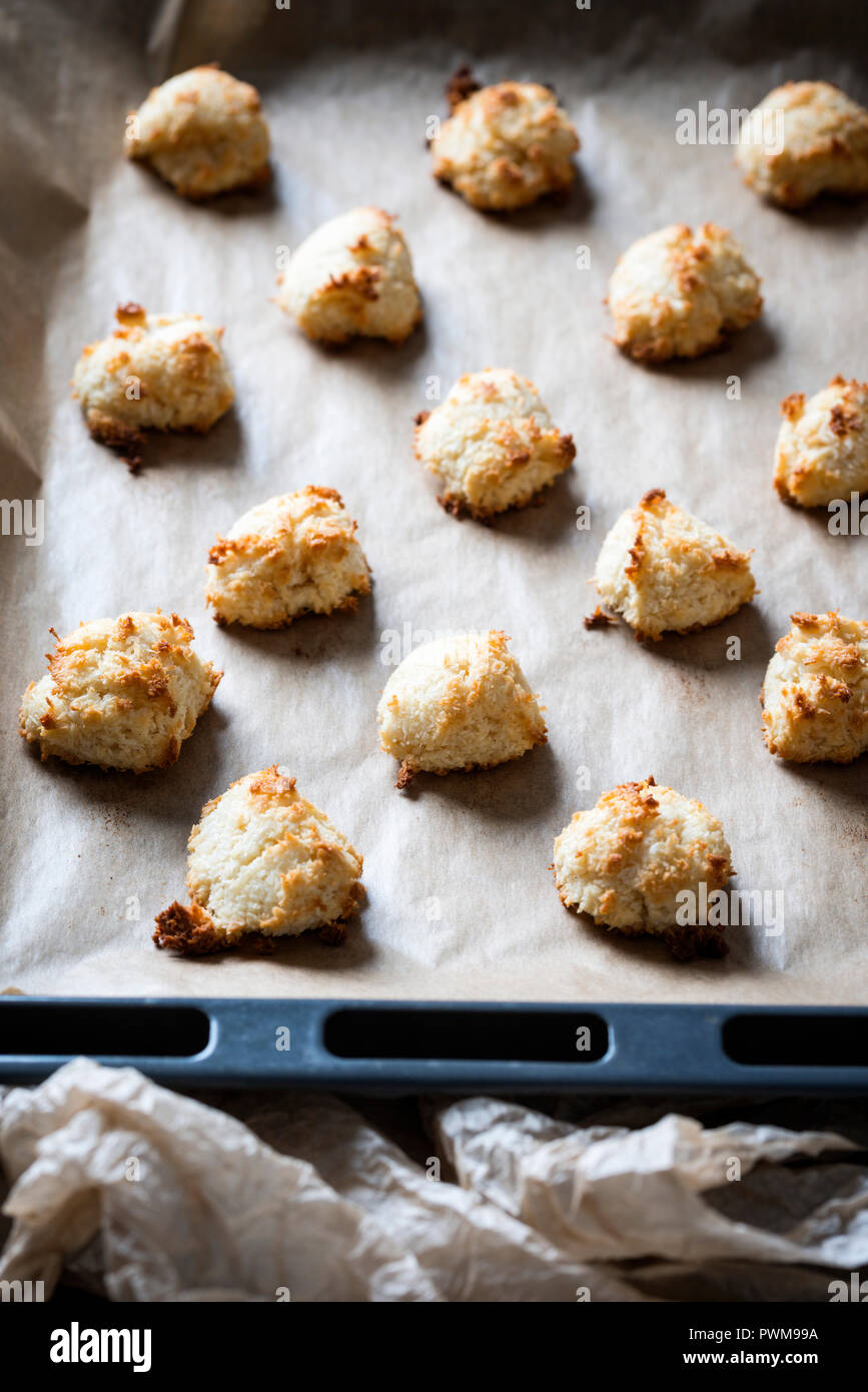 Vegan coconut macaroons on a baking tray Stock Photo - Alamy