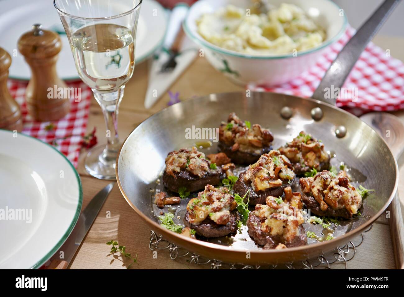 Fillet of venison with a chanterelle mushroom gratin Stock Photo - Alamy