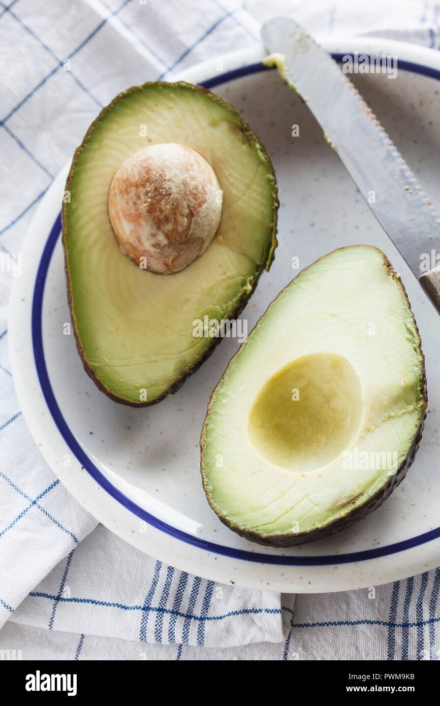 An avocado cut in half Stock Photo - Alamy