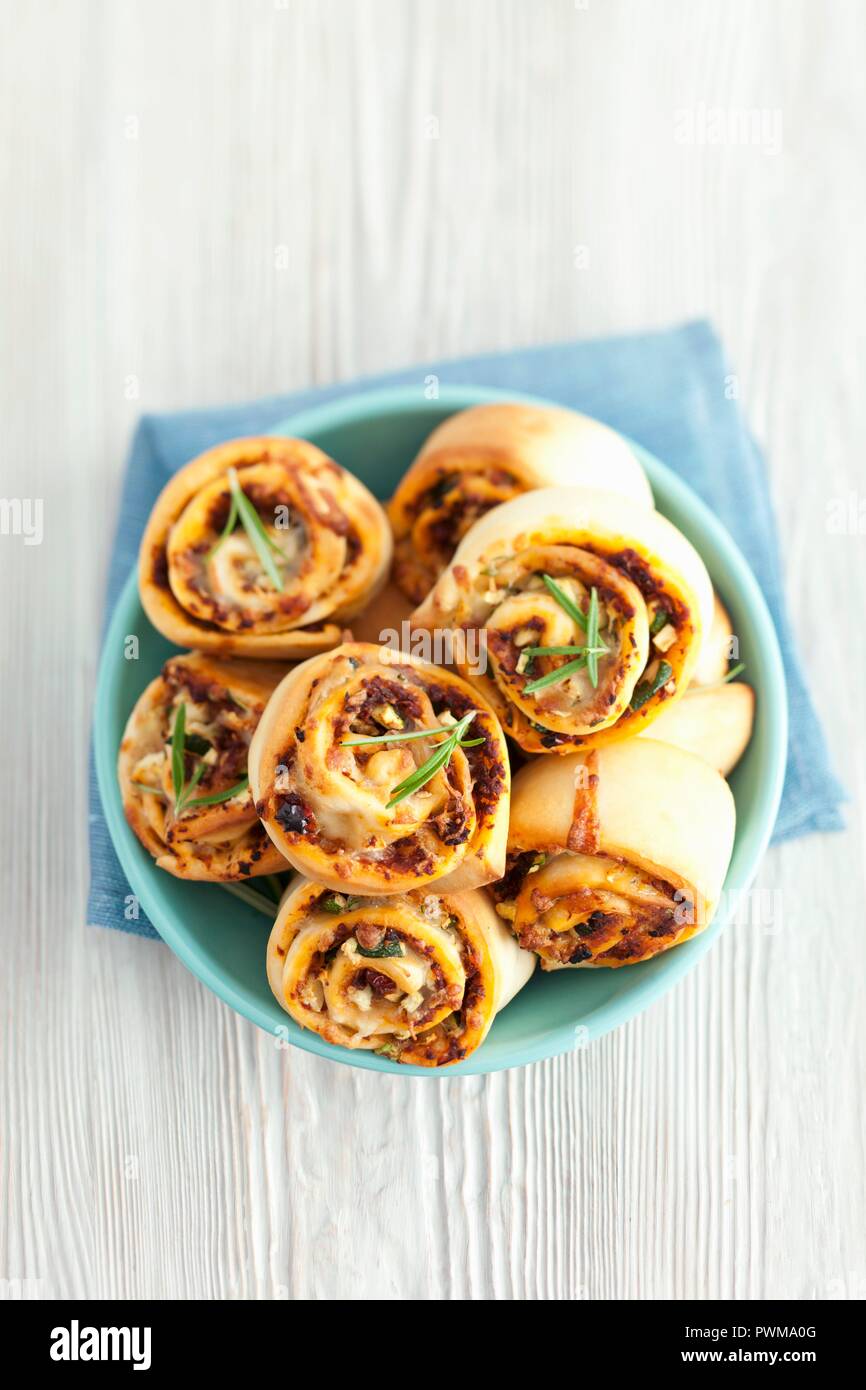 Savoury buns with dried tomatoes, courgette and mozzarella Stock Photo ...