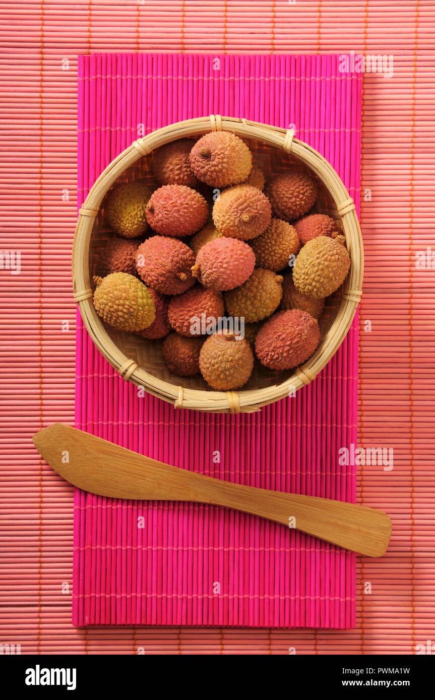 Fresh lychees in a bamboo basket (seen from above Stock Photo - Alamy