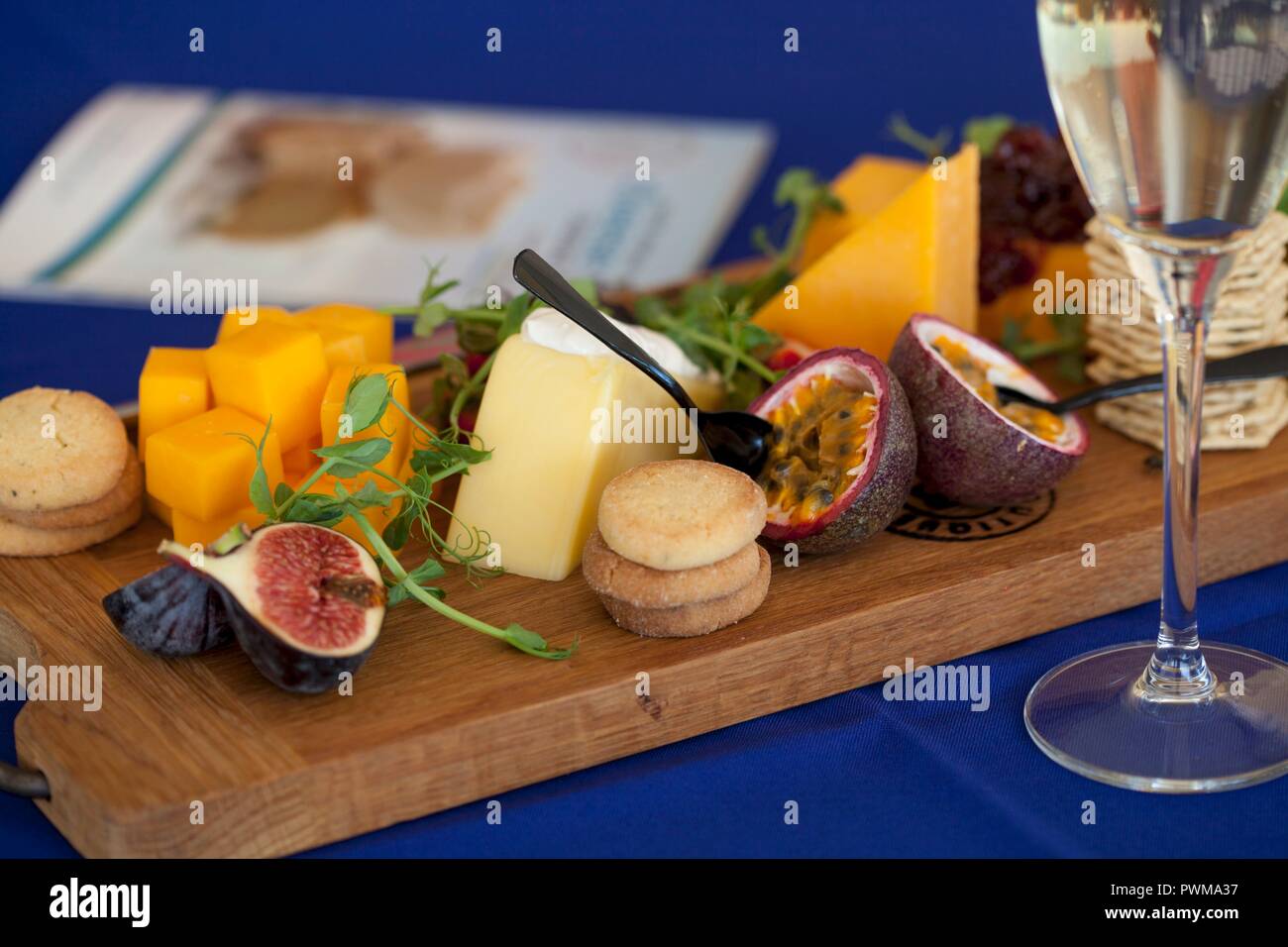 A cheeseboard with biscuits, figs and watercress Stock Photo - Alamy