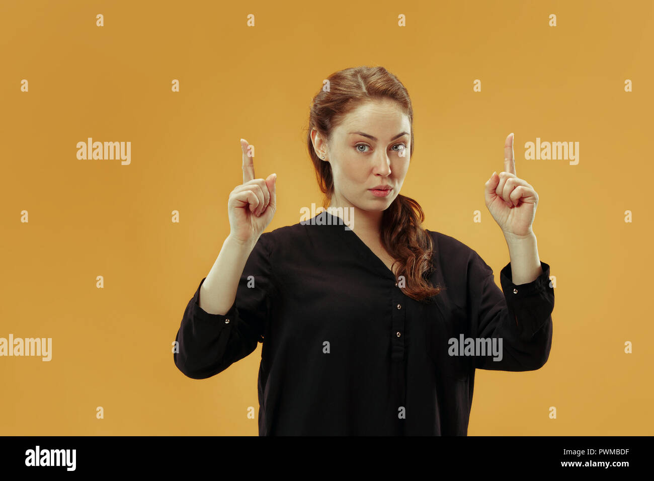 Wow. Beautiful female half-length portrait isolated on gold studio ...