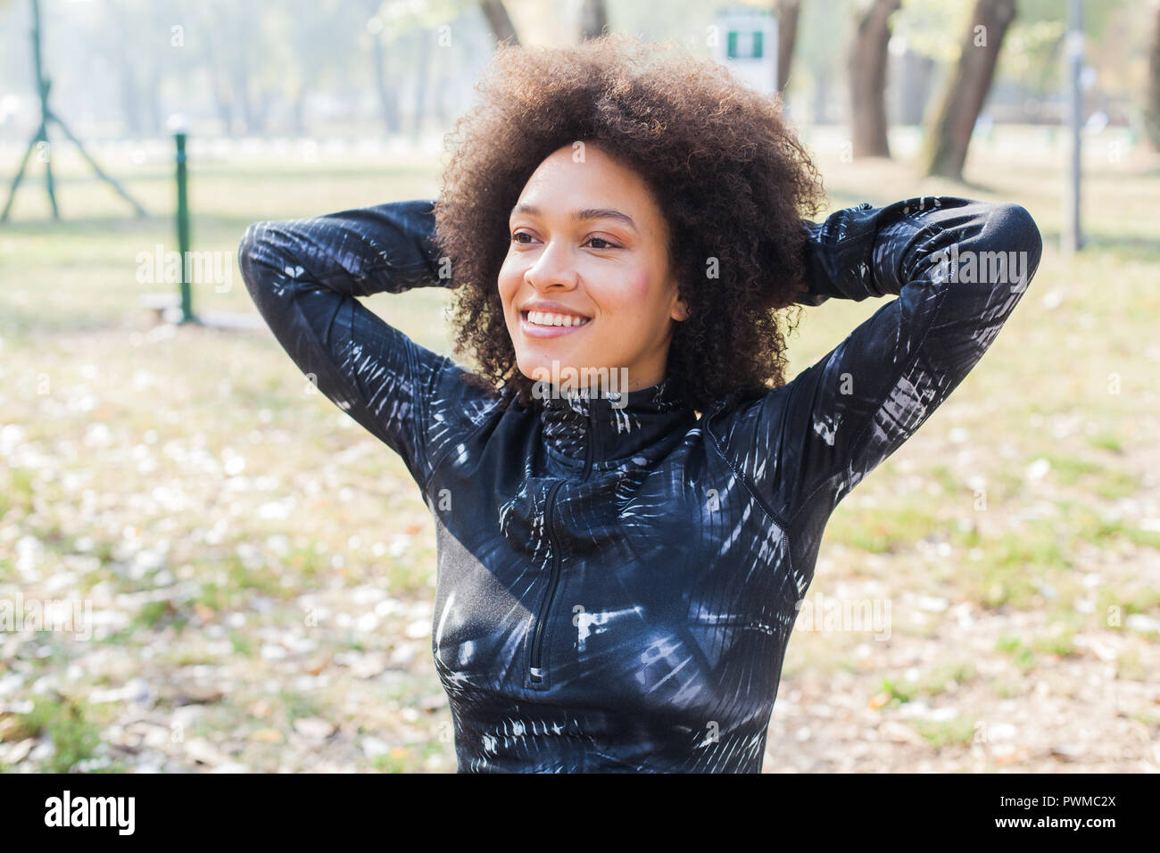 Portrait Of Beautiful Smiling Mixed Race Young Woman Exercise At ...