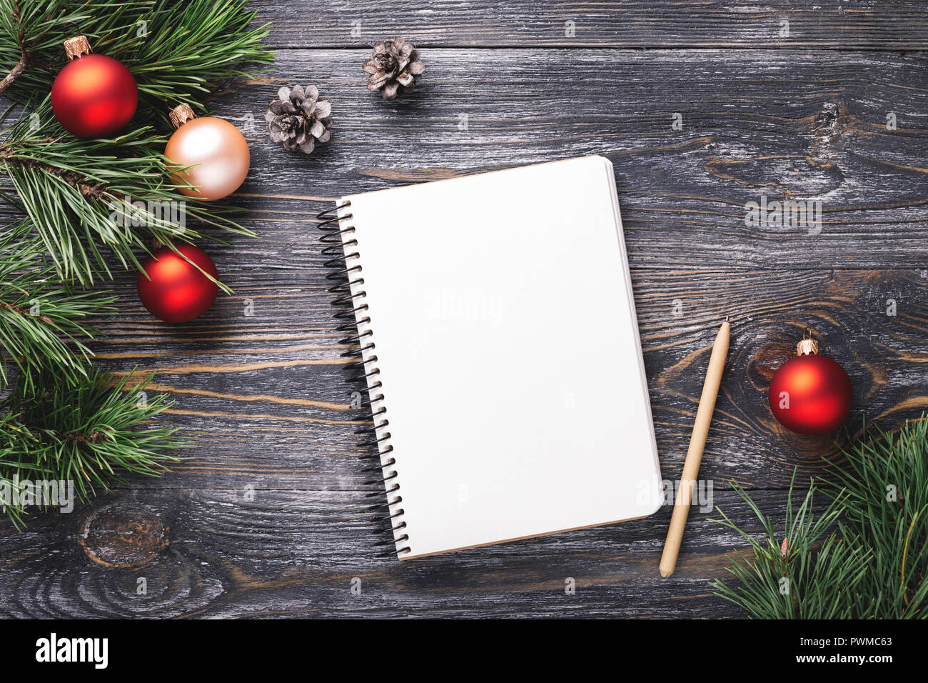 Mockup with white paper notebook and Christmas decorations on wooden ...