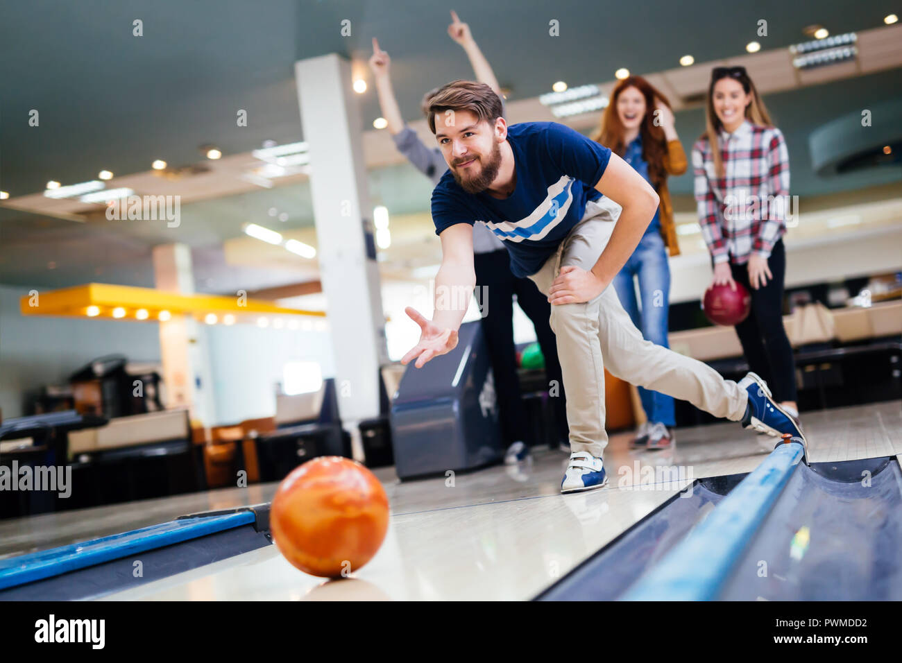 Happy group people bowling having hi-res stock photography and images ...