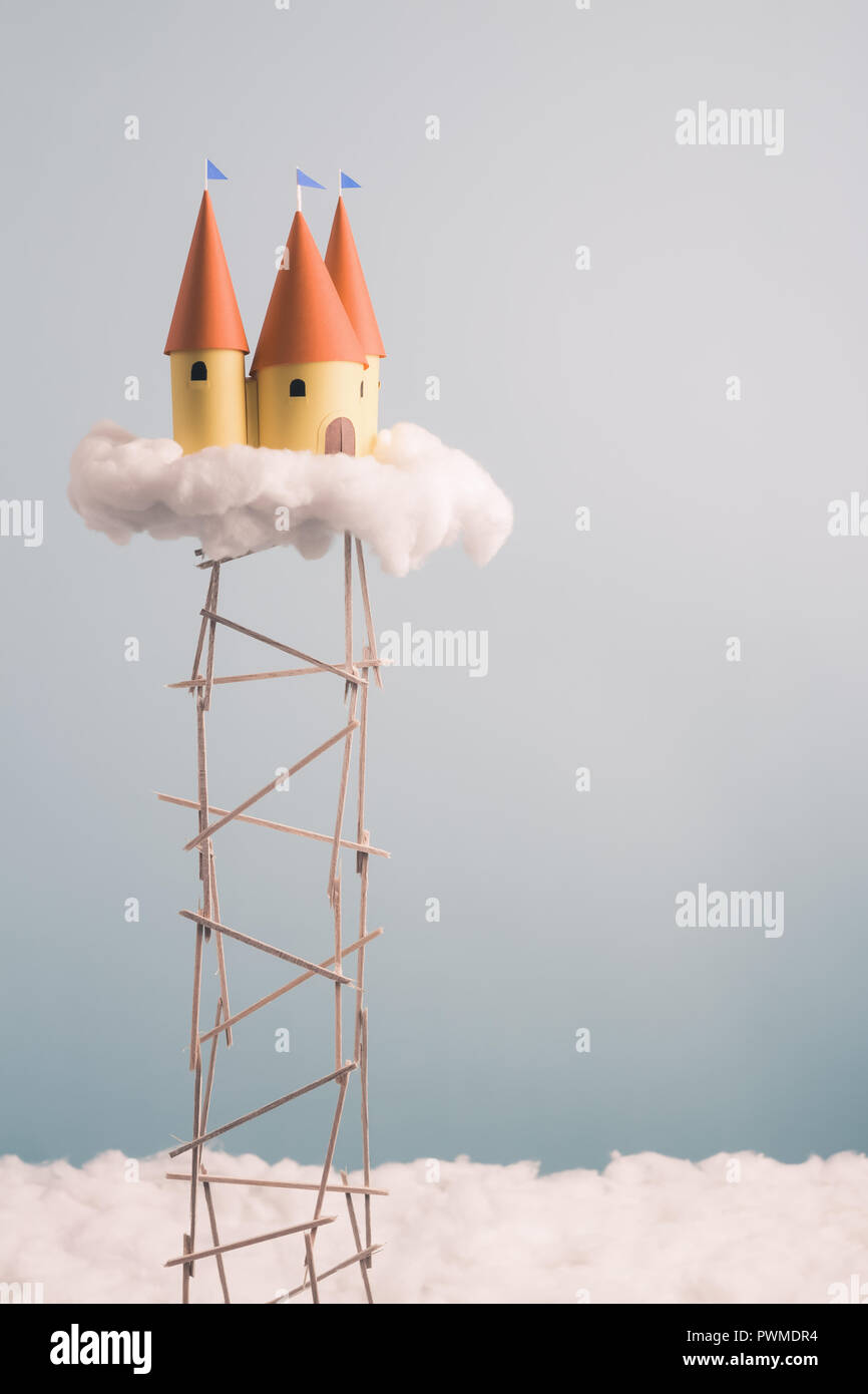 Bird like castle above the clouds on a weak wooden tower Stock Photo ...