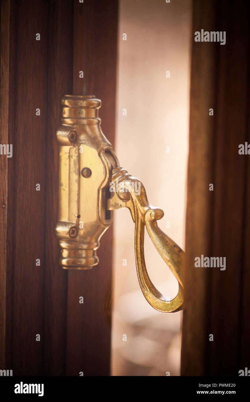 Close up shot of a vintage metal window lever Stock Photo - Alamy