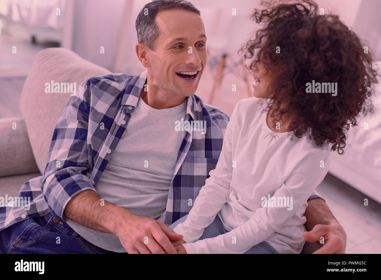 Joyful positive father and daughter having fun together Stock Photo - Alamy