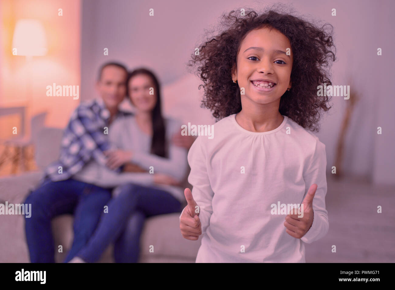 Happy positive girl showing OK signs to you Stock Photo - Alamy