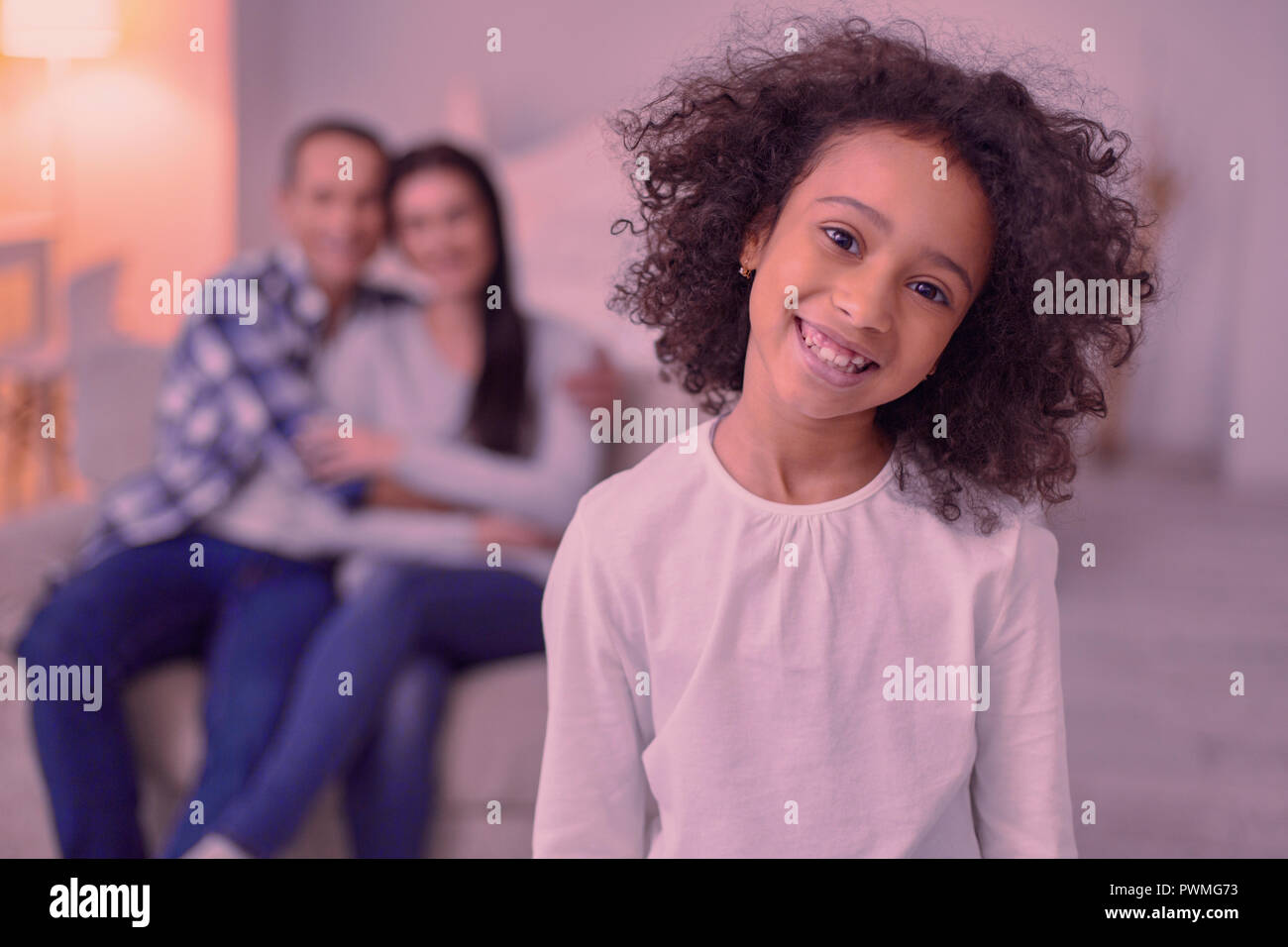 Delighted smiley cute girl feeling absolutely happy Stock Photo - Alamy