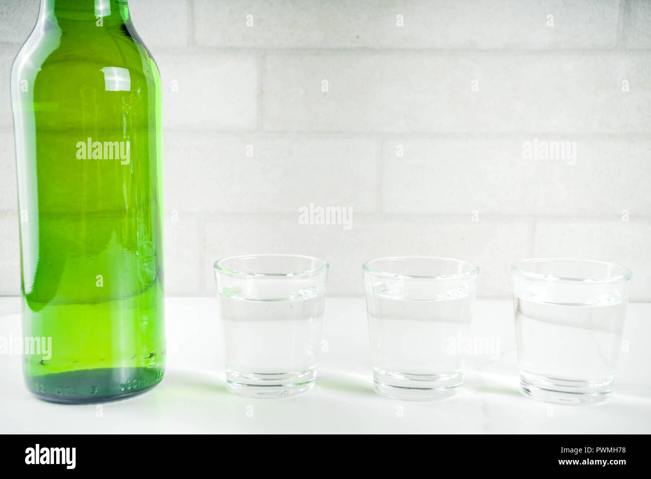 Traditional korean alcohol drink soju on light concrete background copy ...