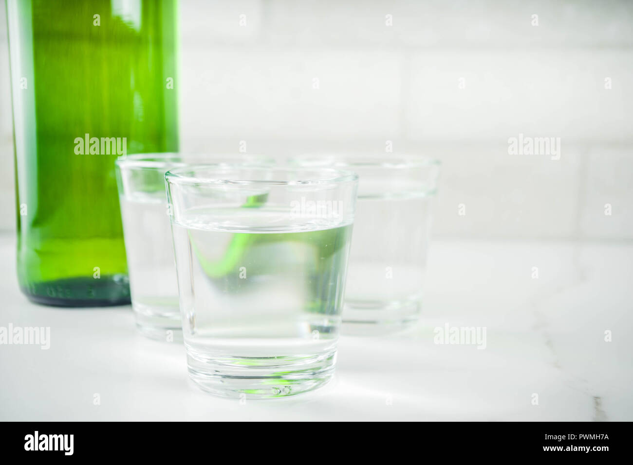 Traditional korean alcohol drink soju on light concrete background copy ...