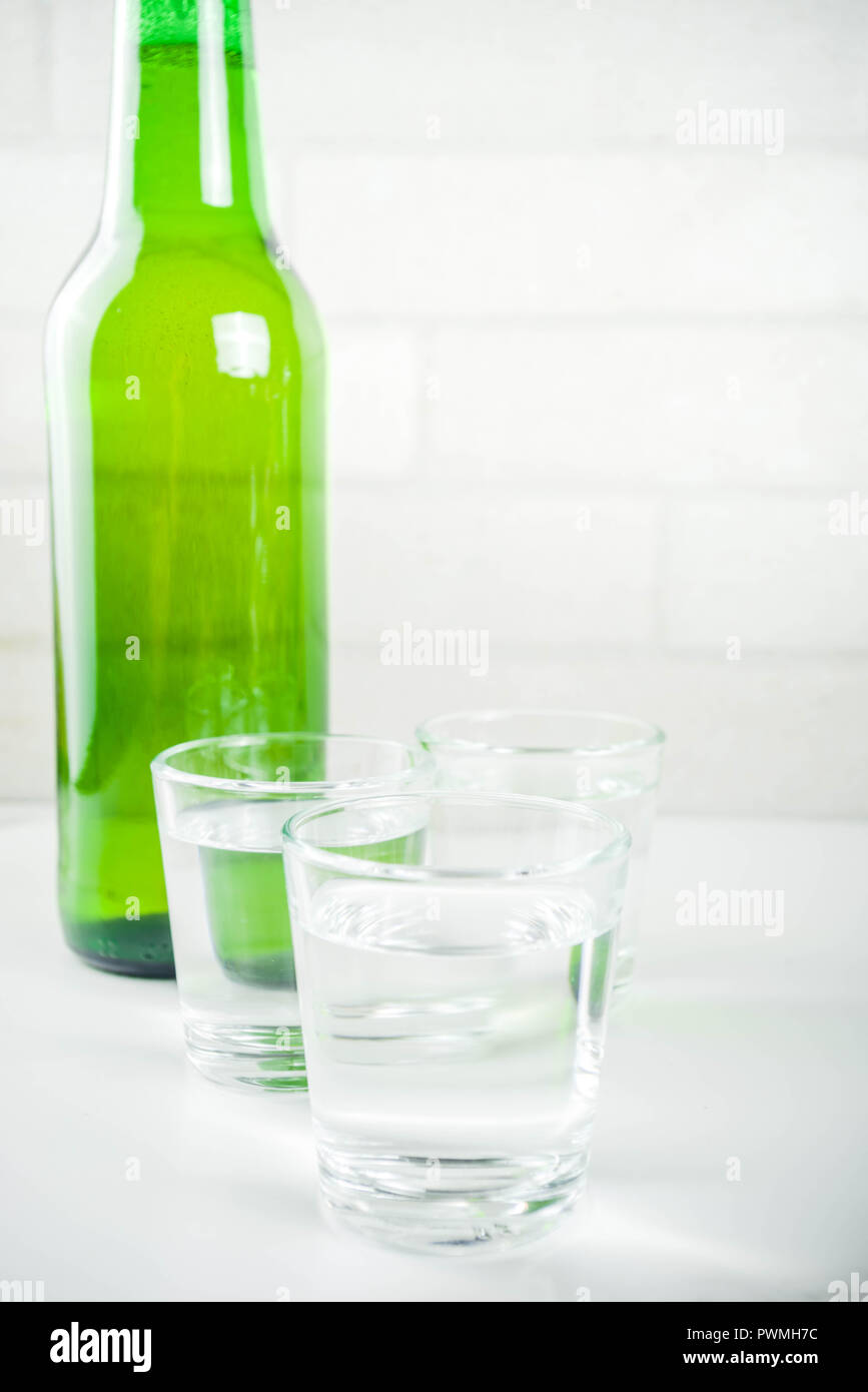 Traditional korean alcohol drink soju on light concrete background copy ...
