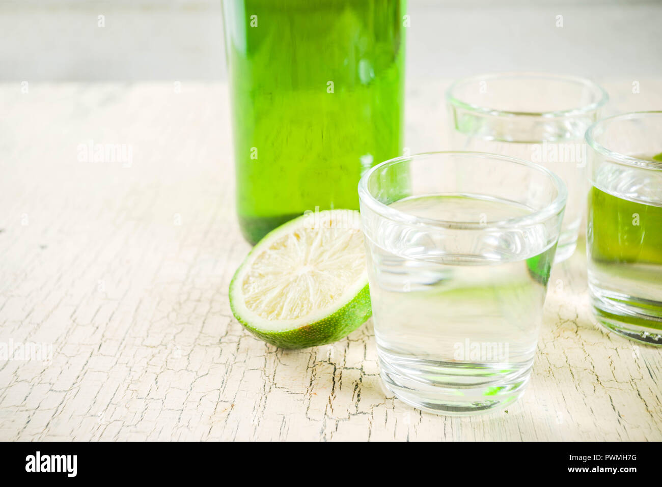 Traditional korean alcohol drink soju on light concrete background copy ...