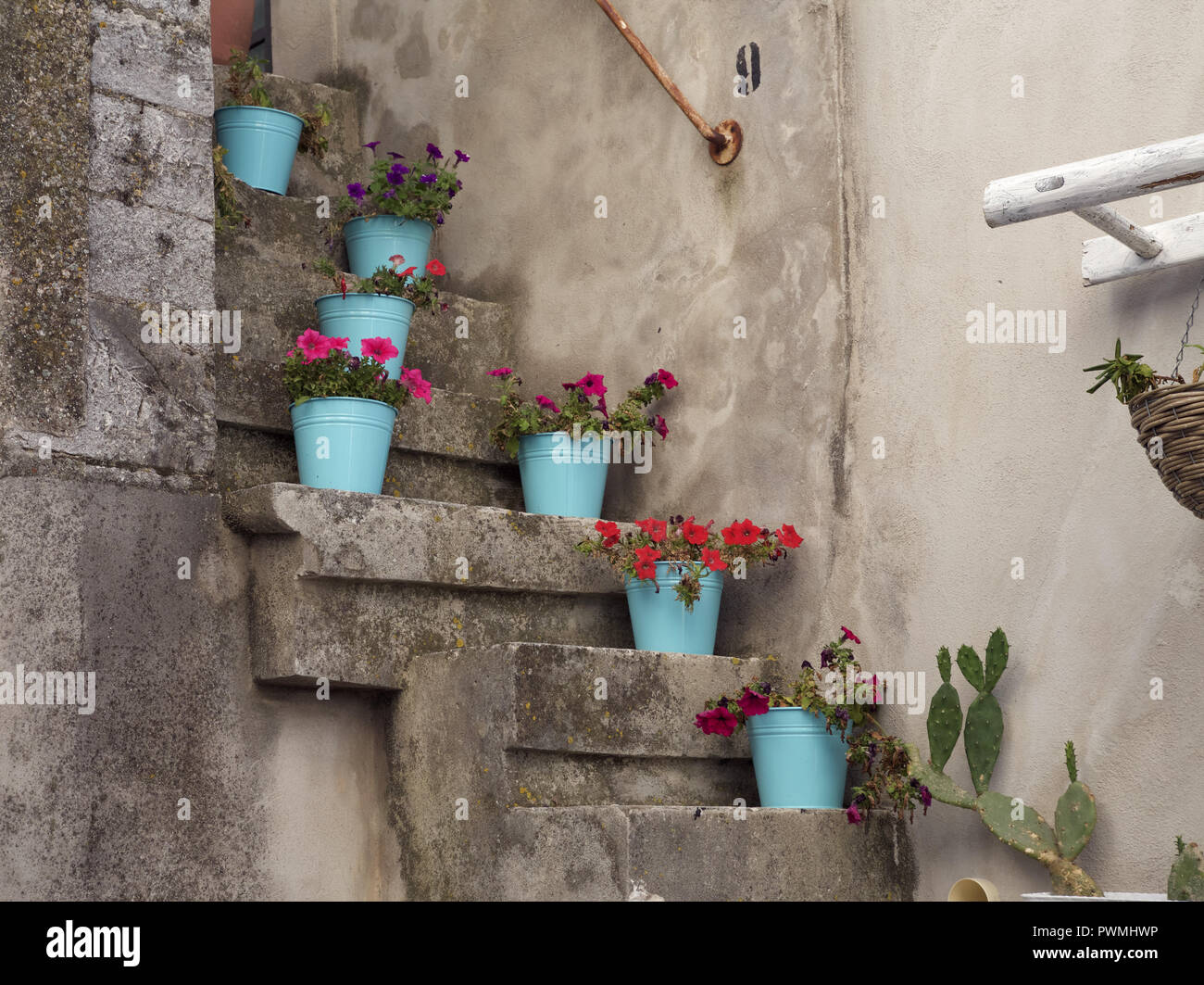Flowerpots on stairs in Italy Stock Photo - Alamy