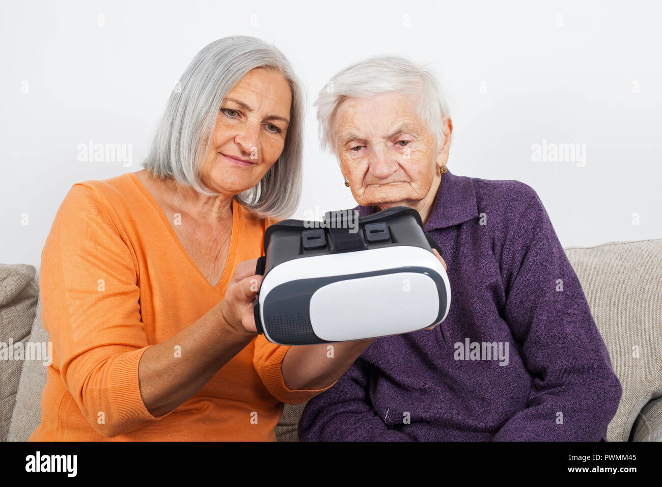 Elderly women experiencing virtual reality video with headset Stock ...