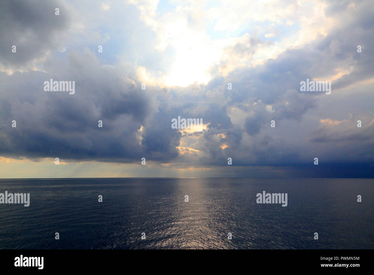 Ocean and grey clouds Stock Photo - Alamy